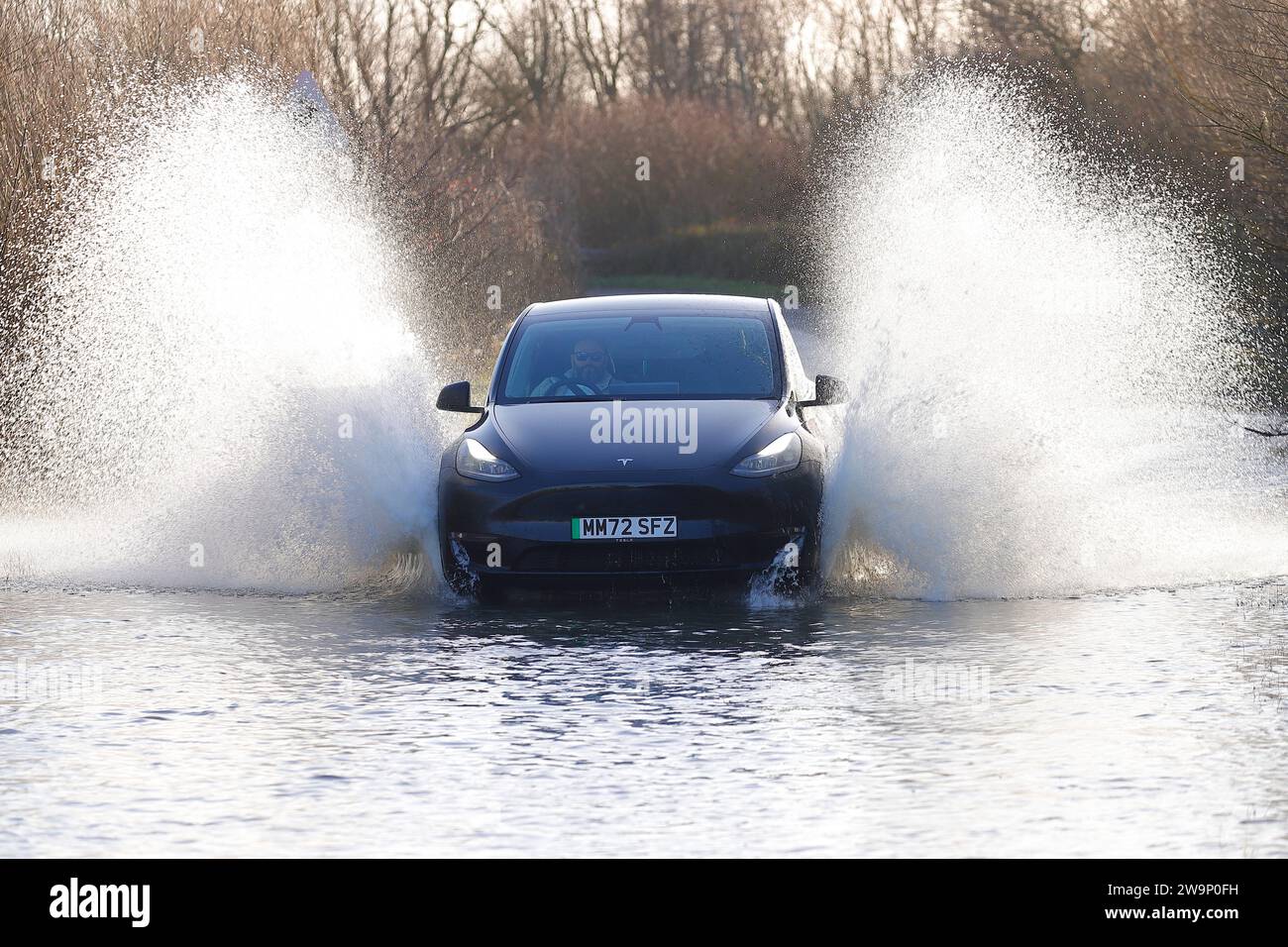 Tesla driving in floods hi-res stock photography and images - Alamy