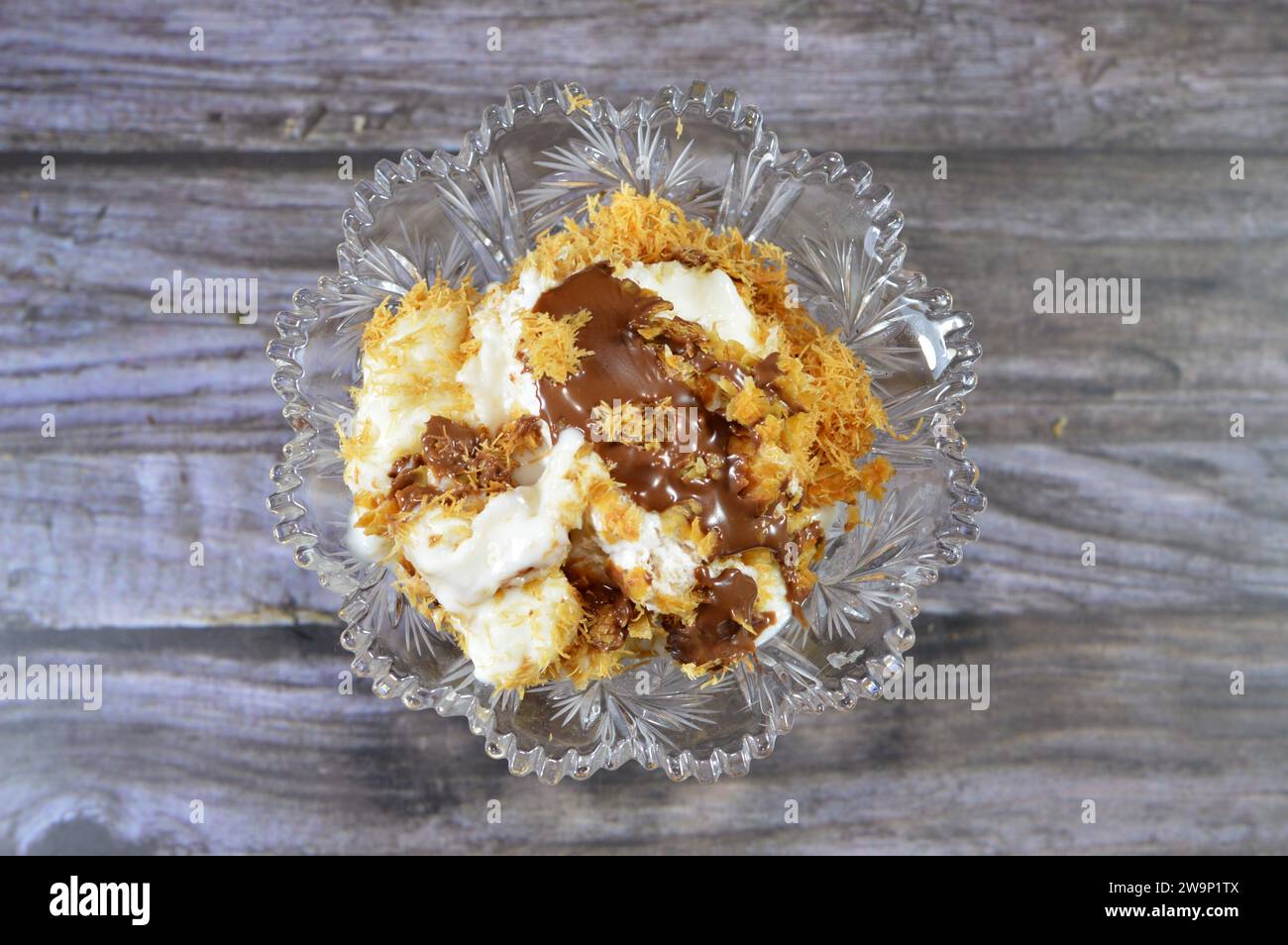chocolate paste sauce on top of Sweet Koshary recipe in Egypt made of ...