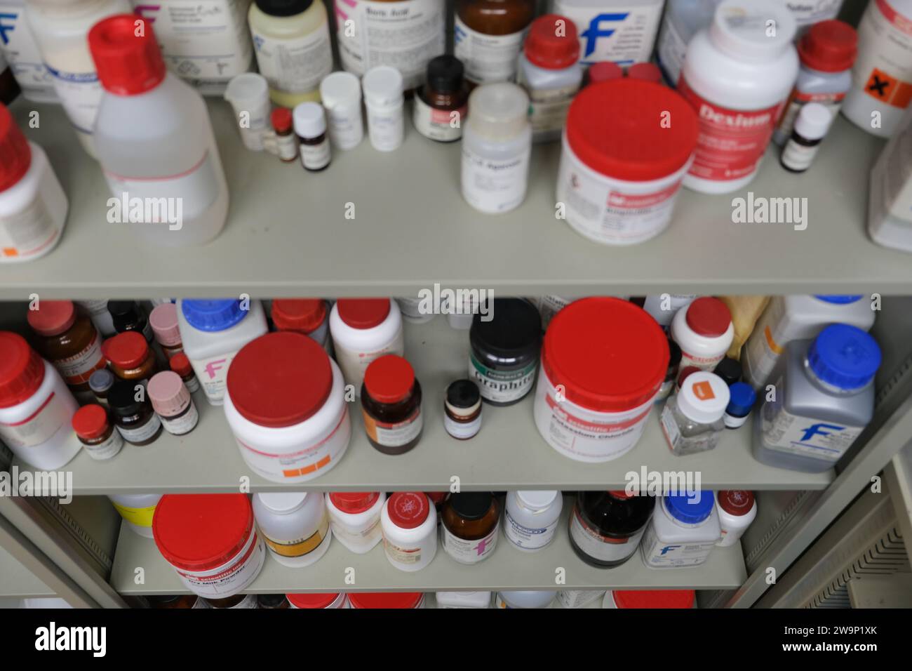 The organized chaos in a cabinet of reagents in a research lab Stock ...