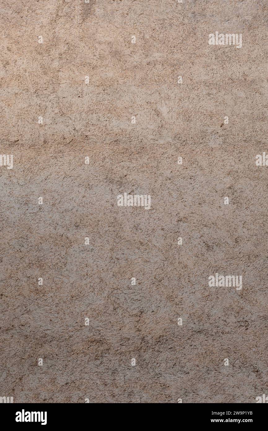 A subtle and smooth peach-colored plaster wall, perfect as a minimalist ...