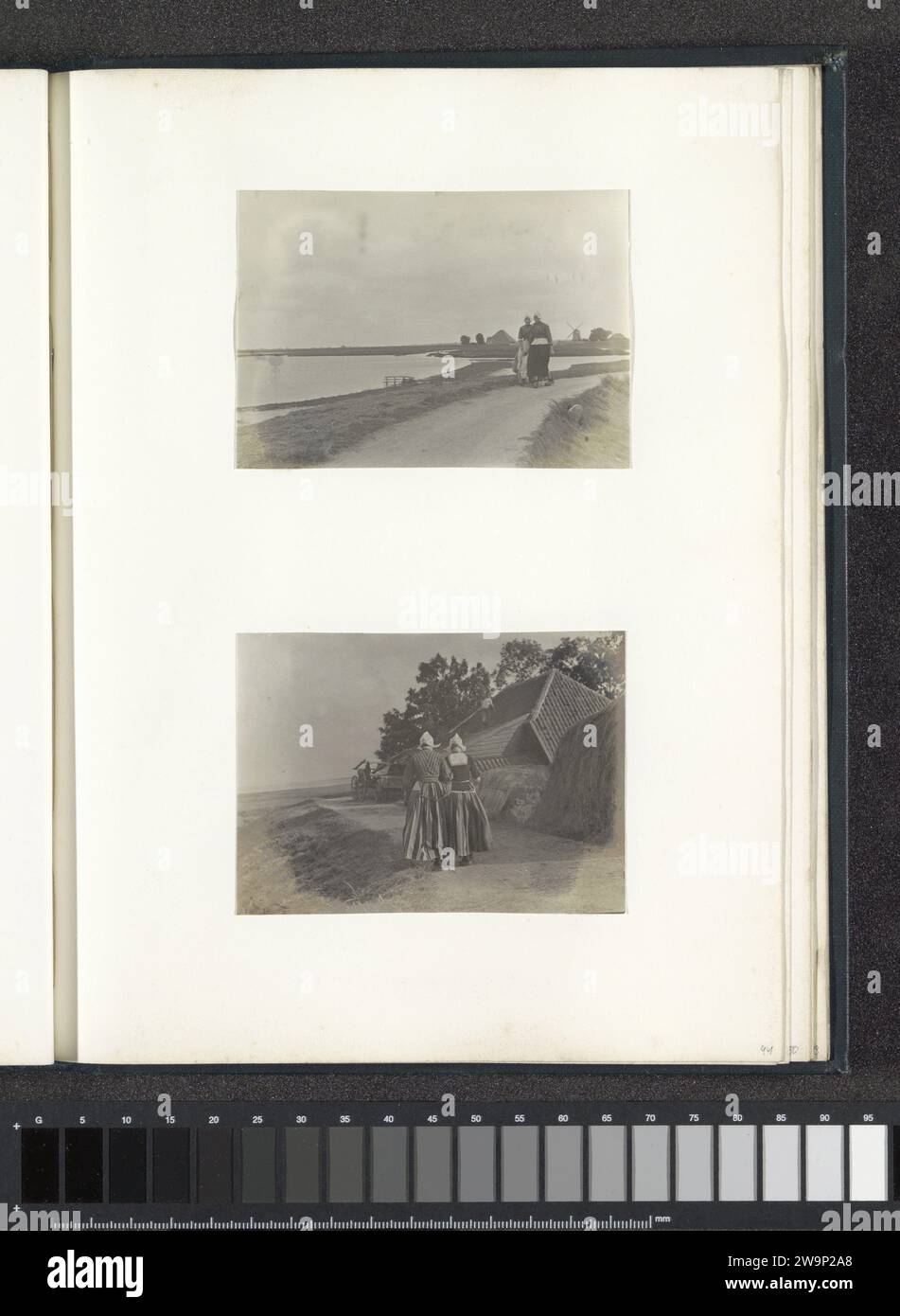 Two women in Volendam costumes walking on a dike, c. 1900 - c. 1910 ...
