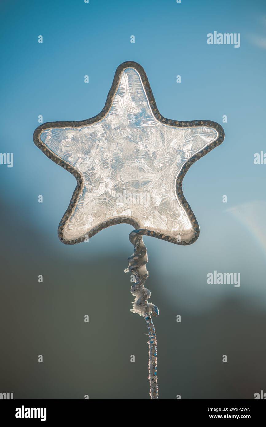 concept winter, frost. beautiful frosty patterns on a star shape, soap ...