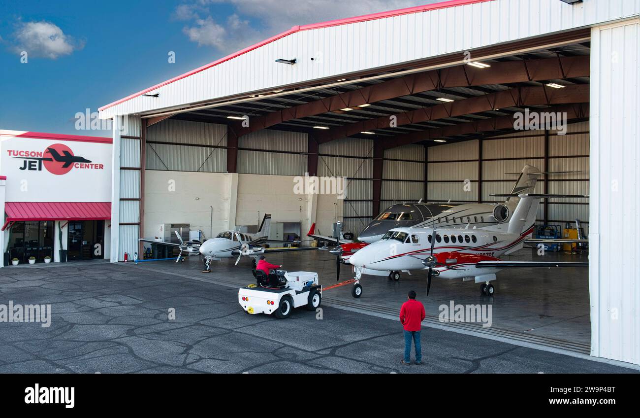 A King Air turbo prop plane being pulled out of a hangar to be readied ...