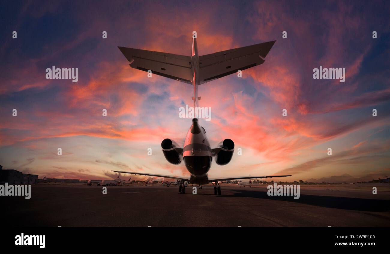 Embraer Phenom 300 private jet rear view looking at the sunset over ...