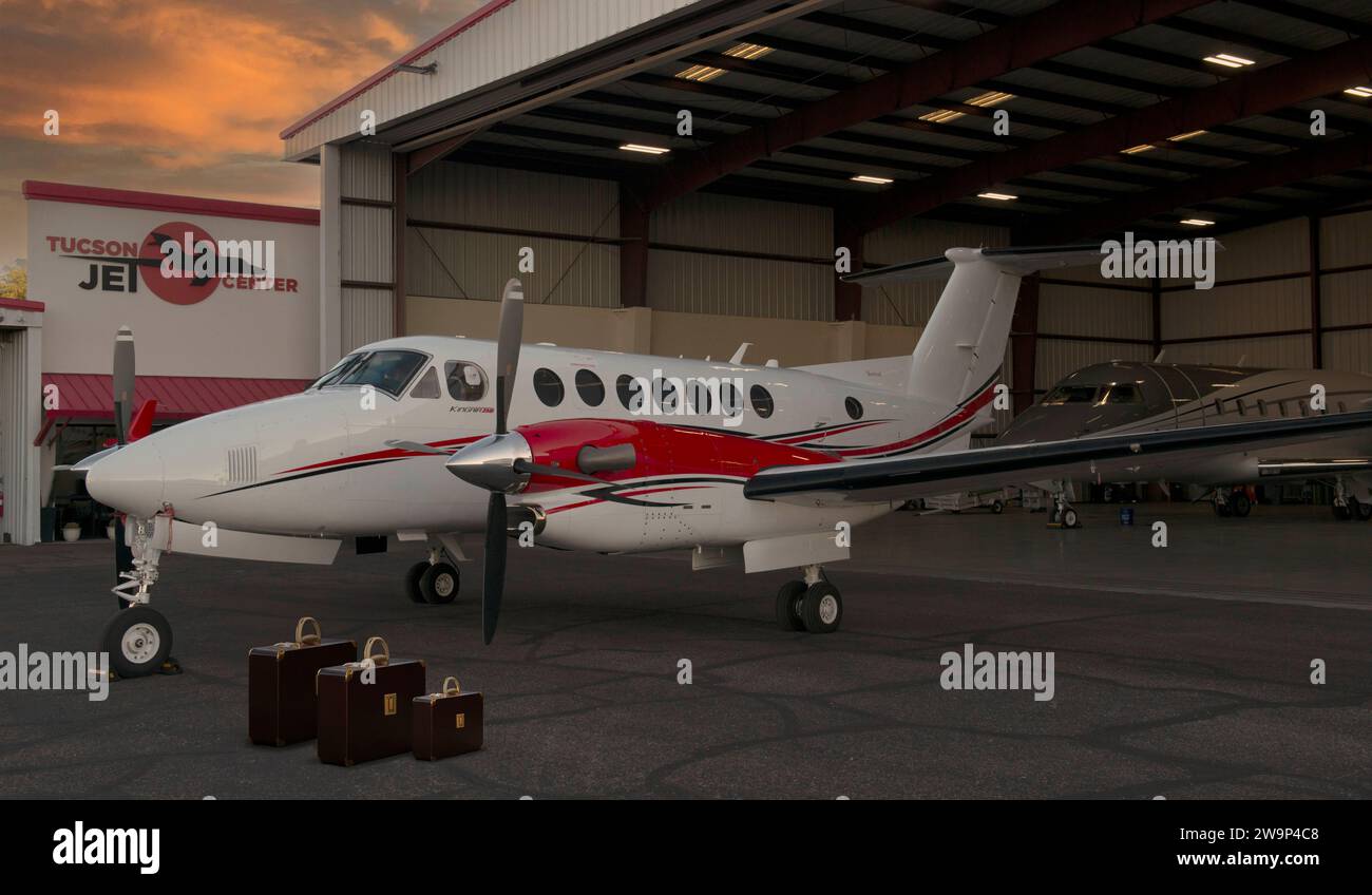 King Air turbo prop plane outside a hangar with luggage ready to load ...