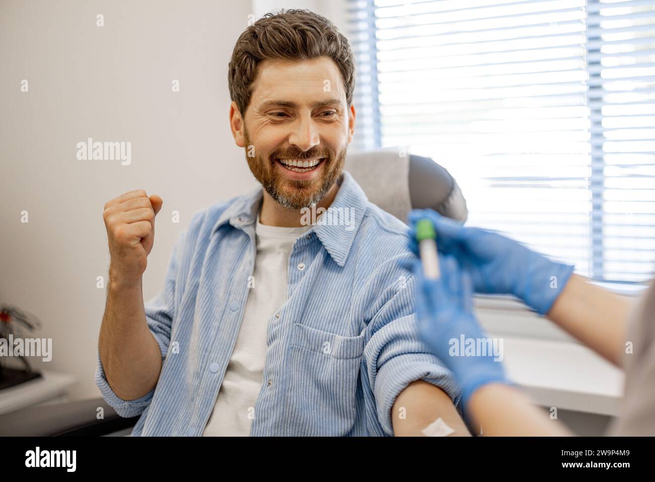 Man gives blood for tests in laboartory Stock Photo - Alamy