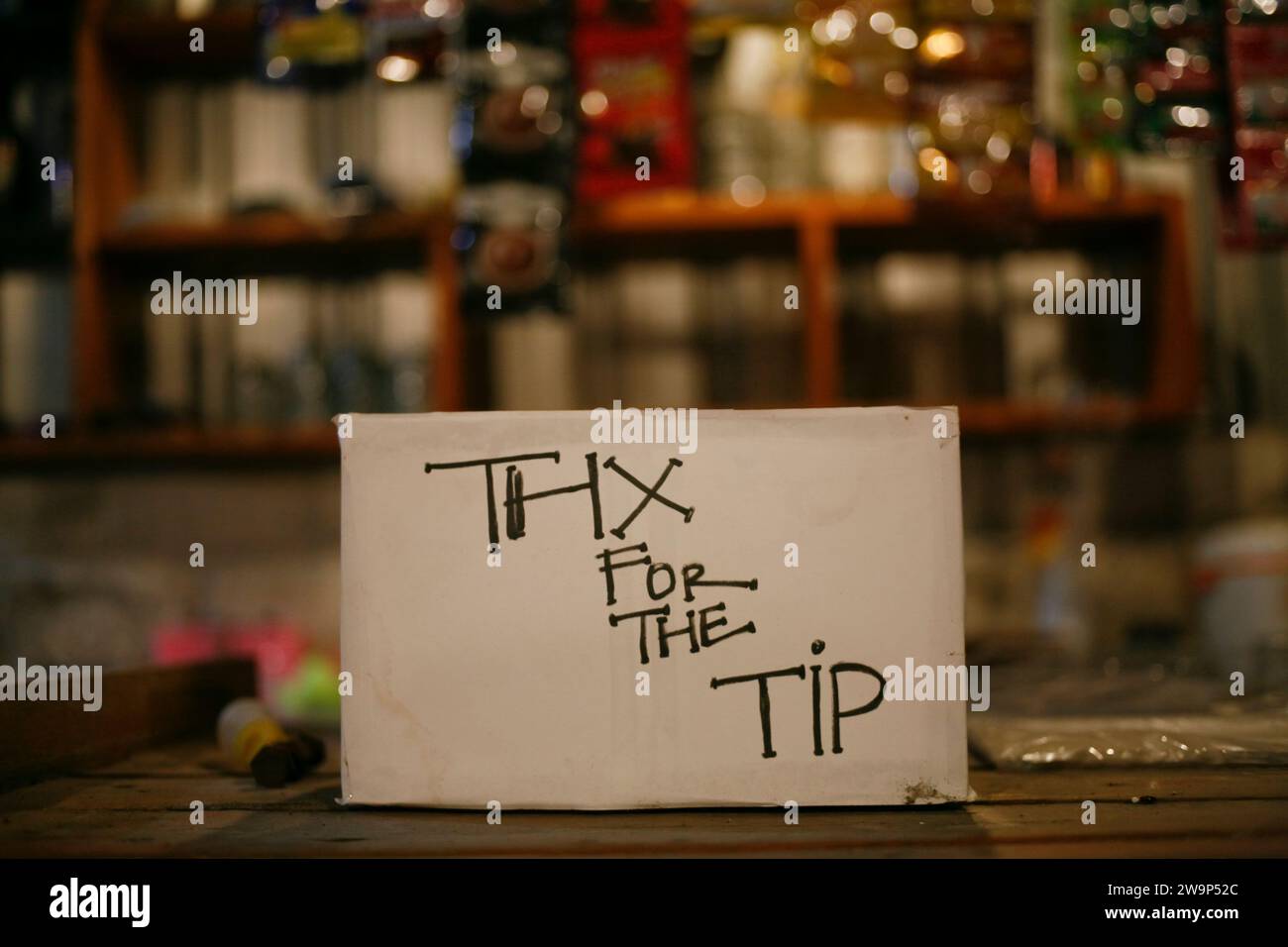 White box with words of thank for the tip in table Stock Photo - Alamy