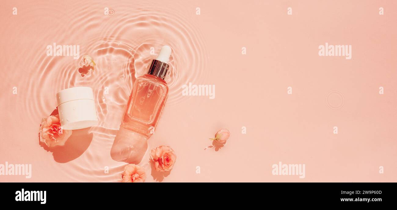 Spring water background with flowers and cosmetics Stock Photo - Alamy
