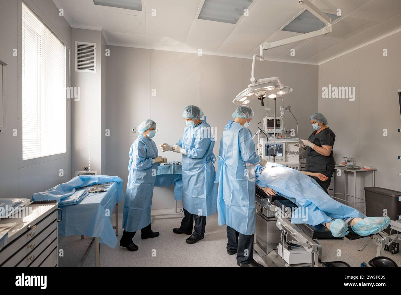 Nurse with surgeon preparing for an operation Stock Photo - Alamy