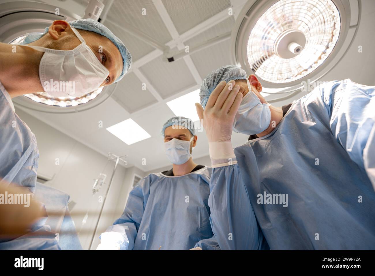 Scary surgeons look at the place of surgical interventio Stock Photo ...