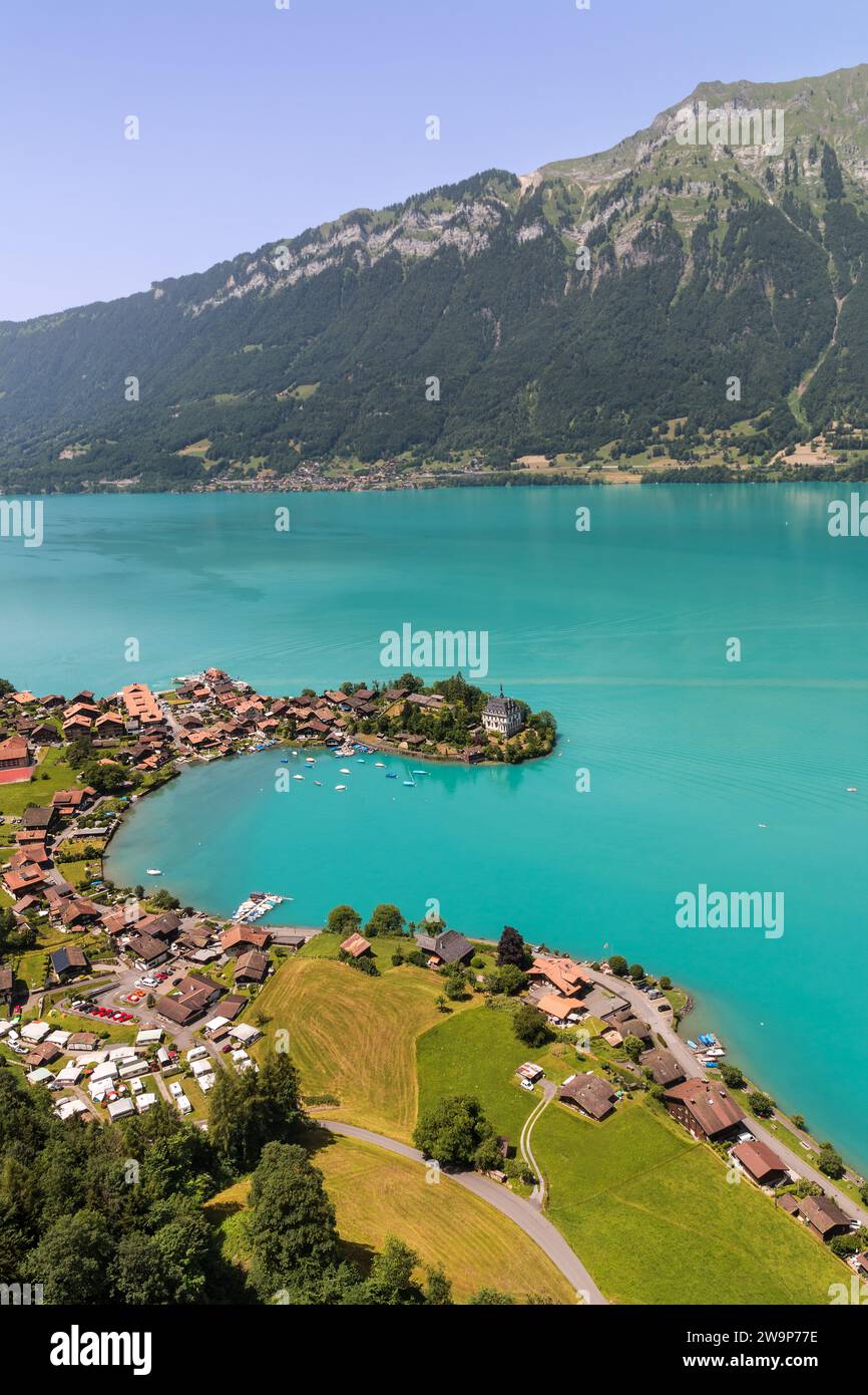 High view over the village of Iseltwald at the turquoise Brienz Lake in ...