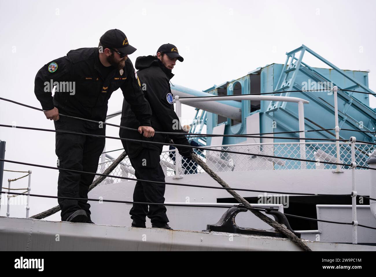 Sailors of the Royal Canadian Navy assist in bringing the preserved ...