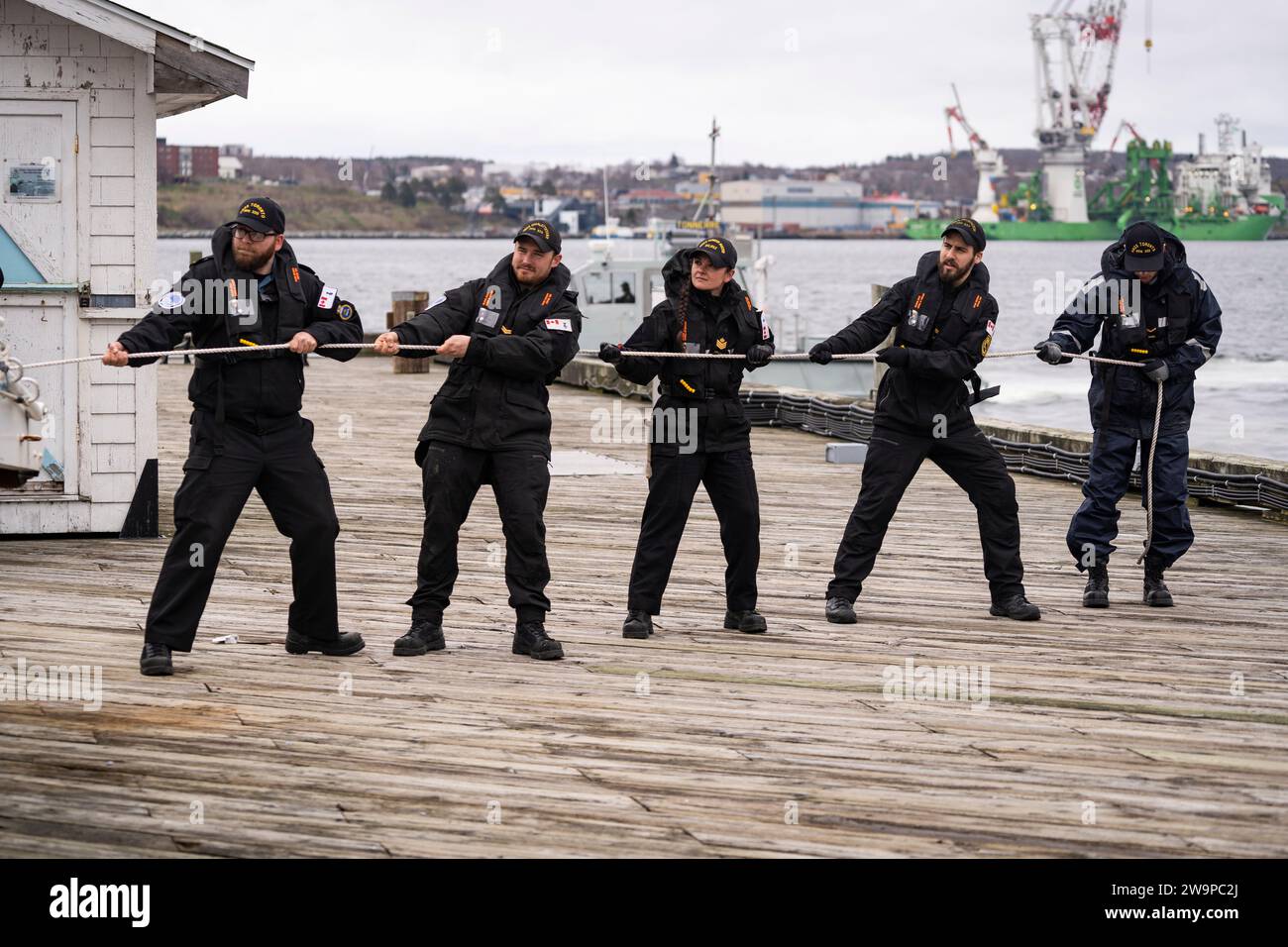Sailors of the Royal Canadian Navy assist in bringing the preserved ...