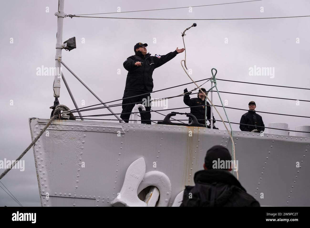 Sailors of the Royal Canadian Navy assist in bringing the preserved ...