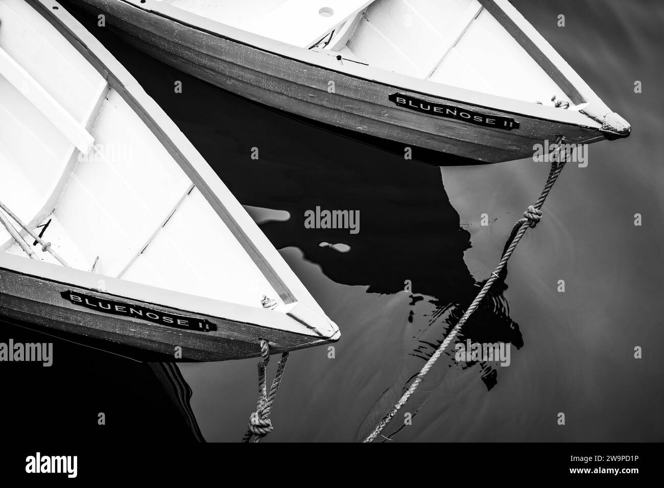 Fishing dory tied up in the harbour on a calm day at Lunenburg, Nova ...