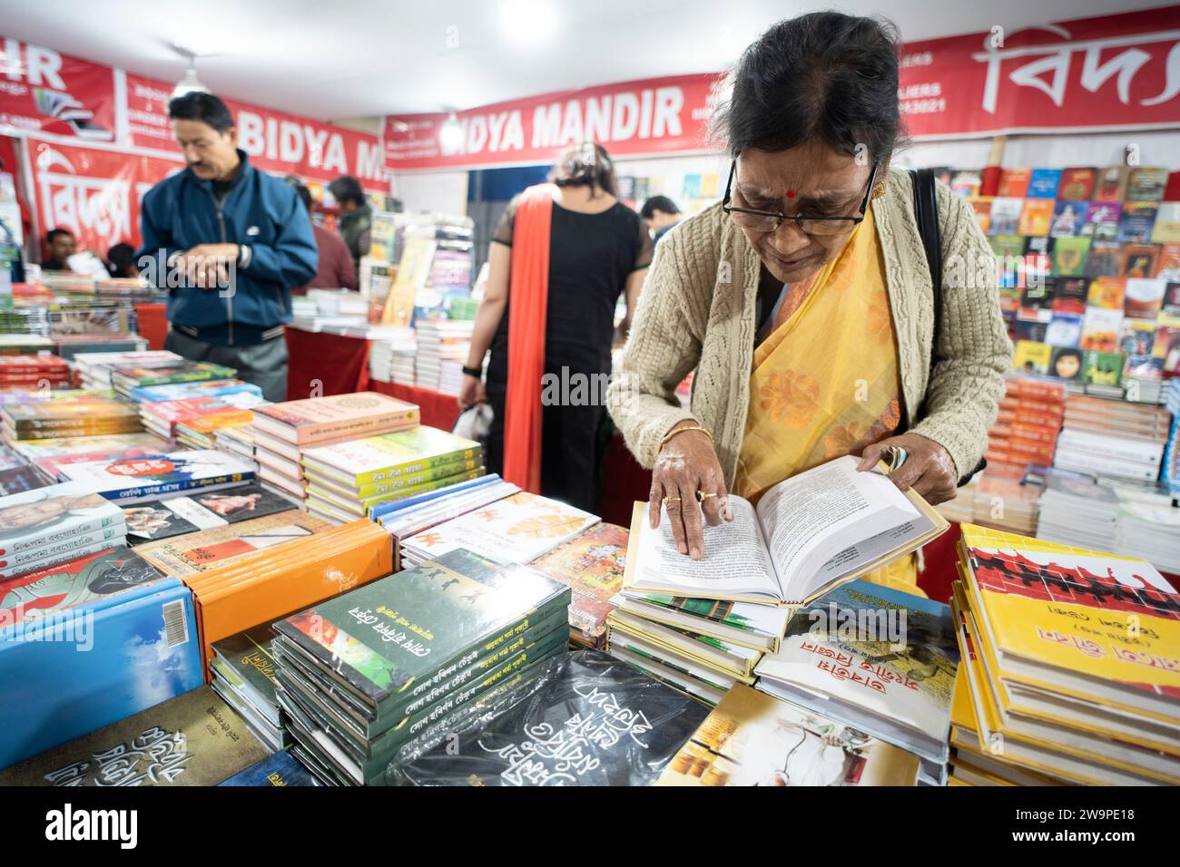 Book readers browsing books at a stall during Assam Book Fair, in ...