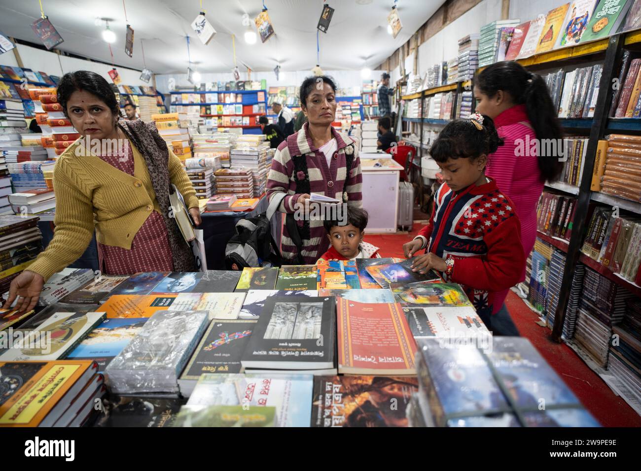 Book readers browsing books at a stall during Assam Book Fair, in ...