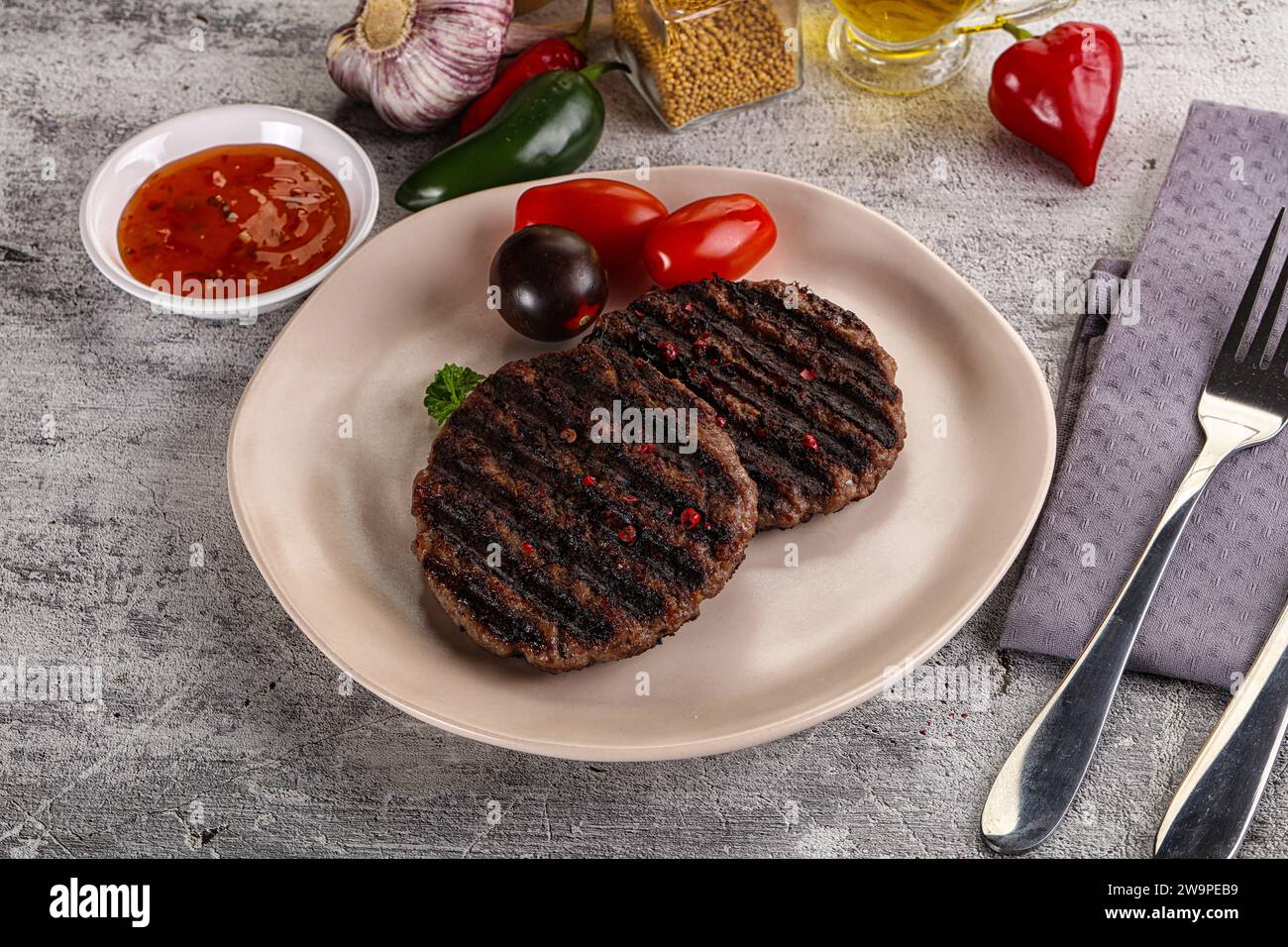 Grilled beef burger cutlet with sauce Stock Photo - Alamy