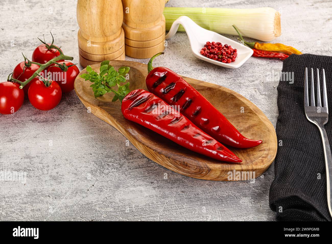 Grilled red spicy pepper snack in the bowl Stock Photo - Alamy