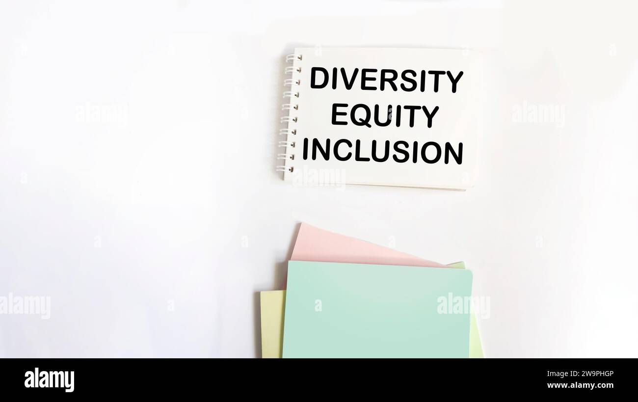 Diversity, equity, inclusion DEI symbol. On the notepad are the words ... Diversity, equity, inclusion DEI symbol. On the notepad are the words ...