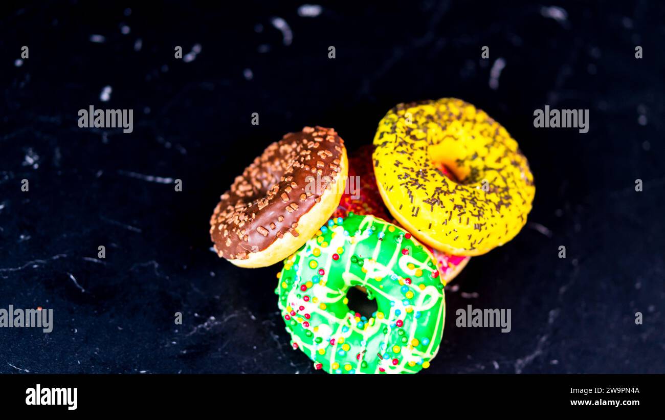 Glazed donuts with sprinkles isolated. Close up of colorful donuts ...