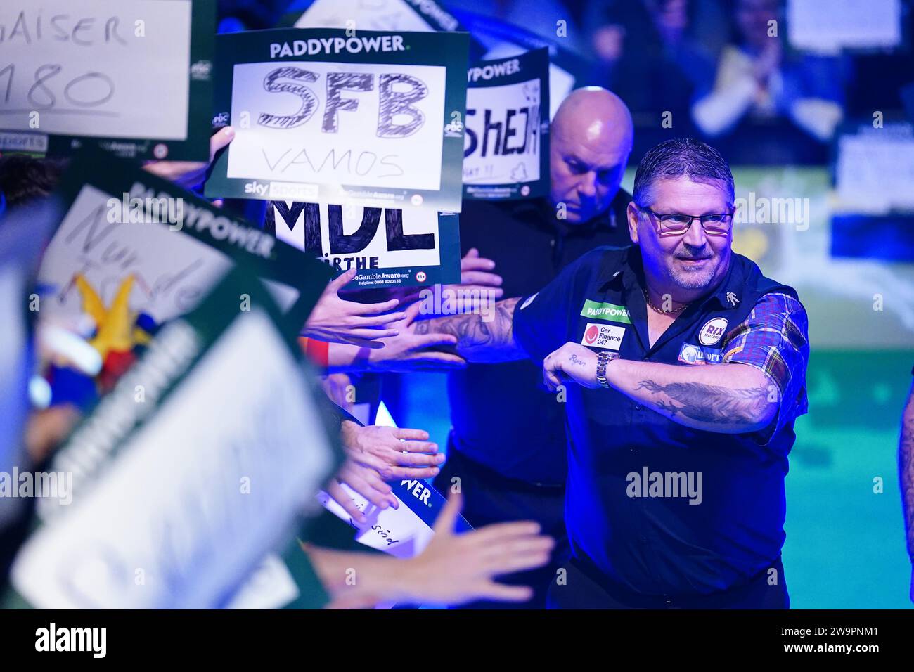Gary Anderson walks out to play Boris Krcmar (not pictured) on day ...
