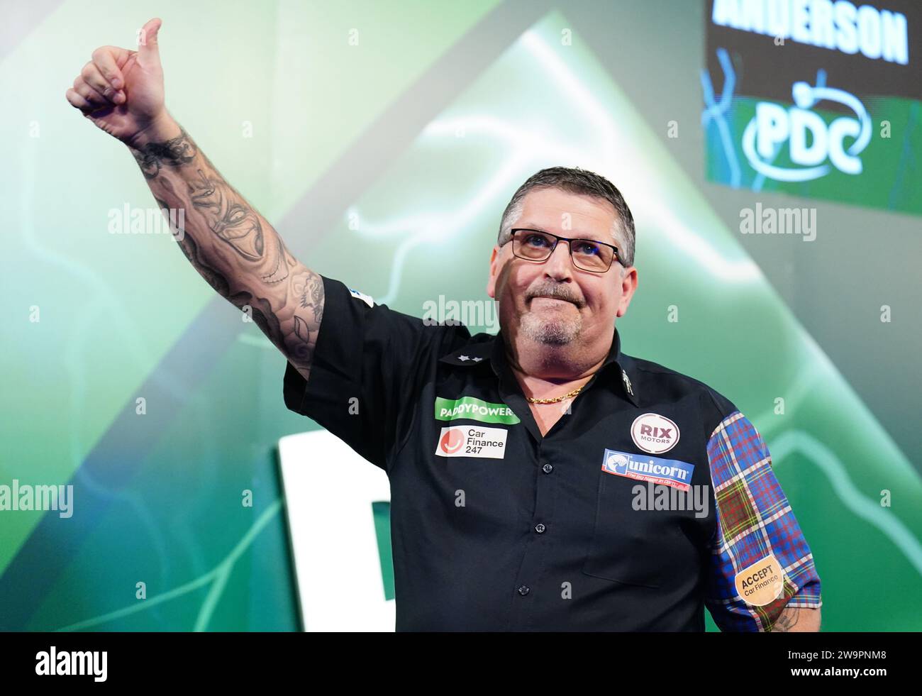Gary Anderson walks out to play Boris Krcmar (not pictured) on day ...