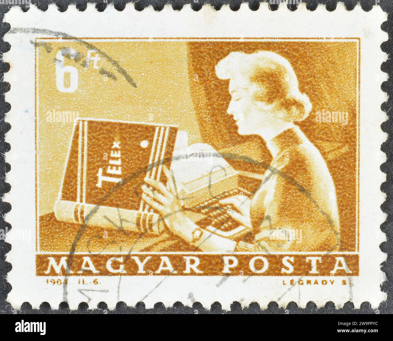 Cancelled postage stamp printed by Hungary, that shows Telex operator ...