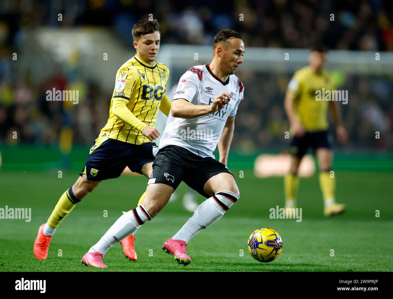 Oxford United's Tyler Goodrham (left) and Derby County's Kane Wilson ...