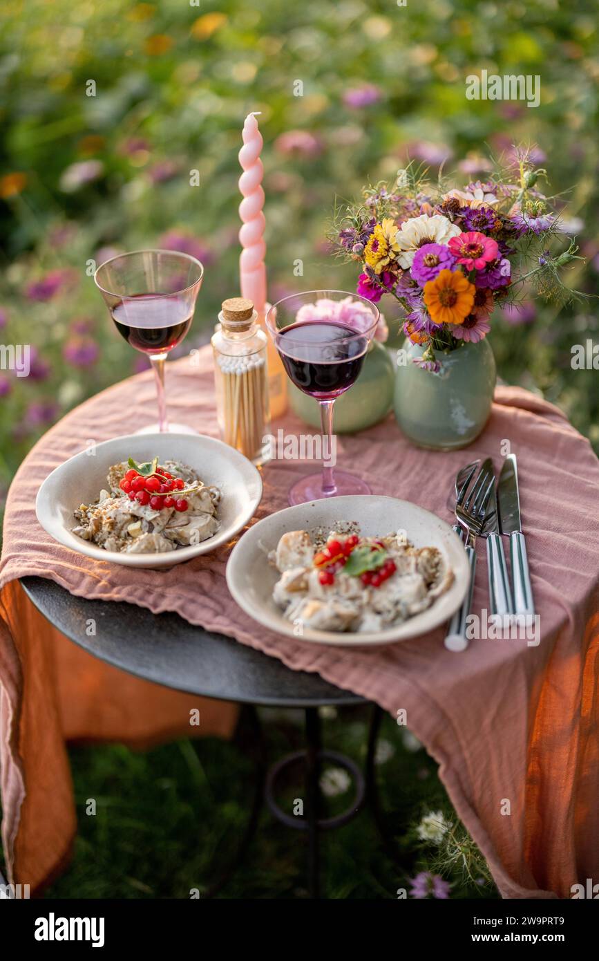Romantic dinner for two on nature Stock Photo - Alamy