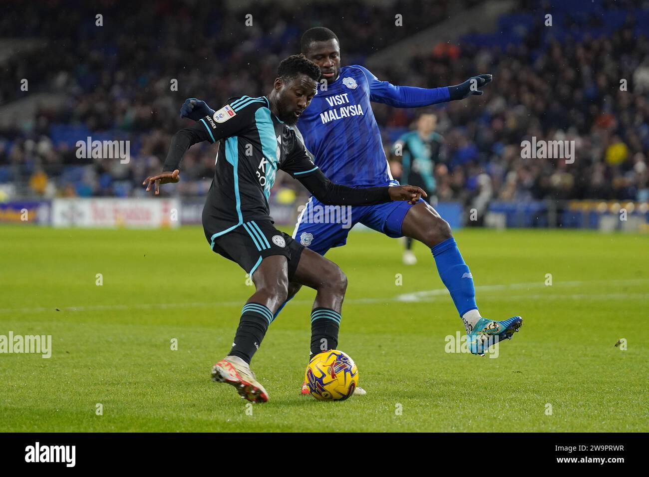 Cardiff City's Jamilu Collins (right) and Leicester City's Patson Daka ...