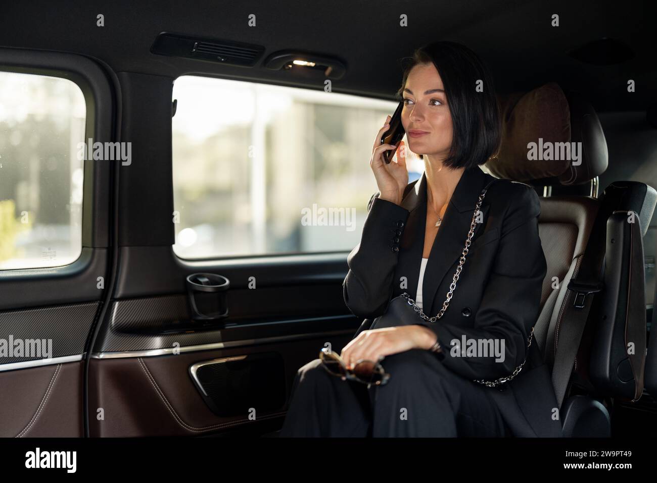 Smiling business lady sitting hi-res stock photography and images - Alamy