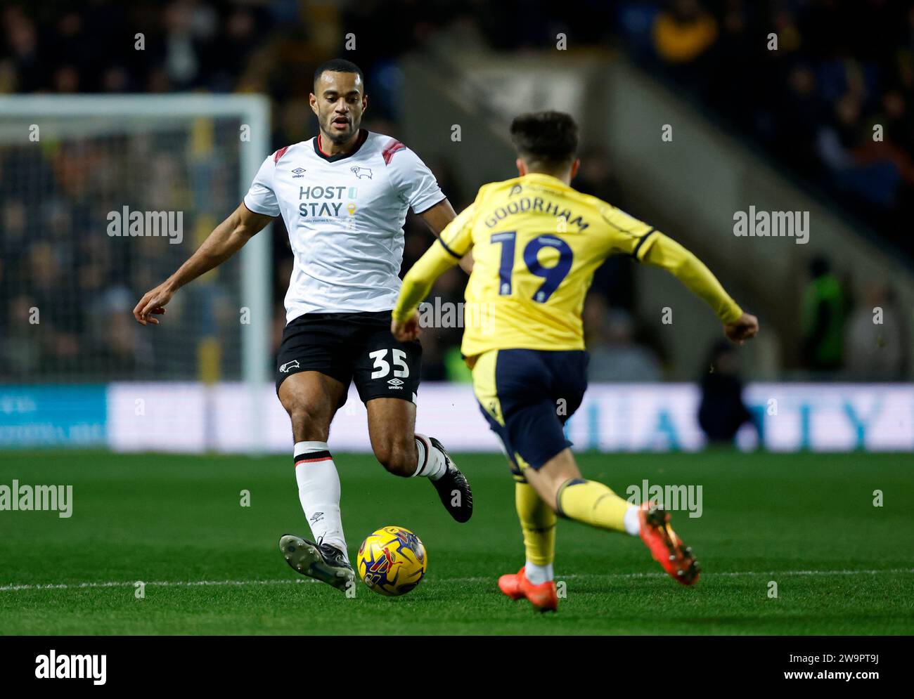 Derby County's Curtis Nelson (left) and Oxford United's Tyler Goodrham ...