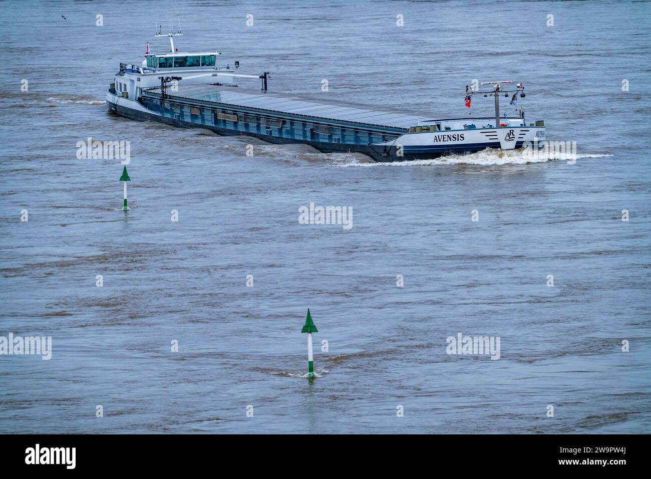 High water on the Rhine at Duisburg, freighter on the river at Duisburg ...