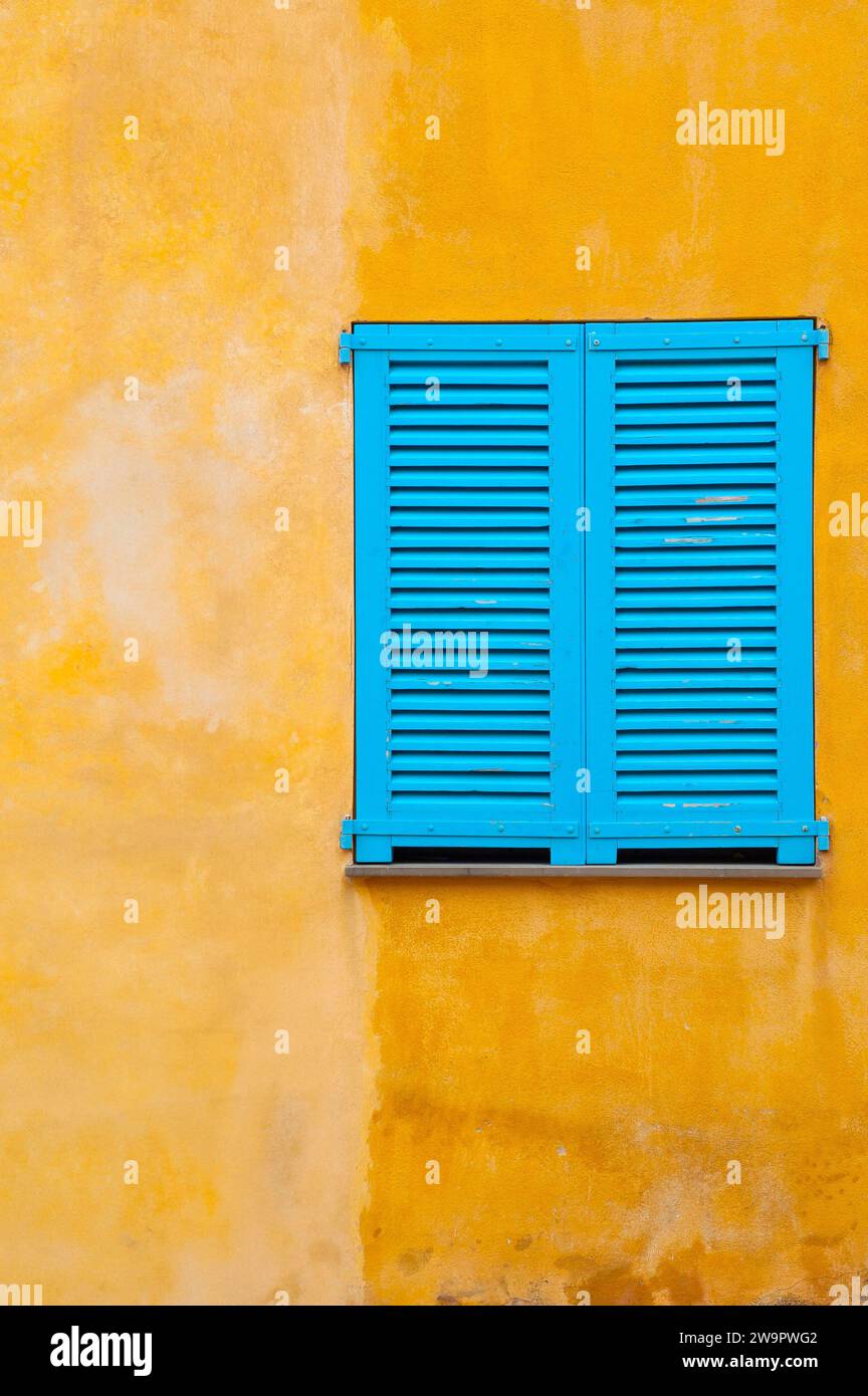 Blue shutter on yellow plaster wall, window, wall, background, texture ...
