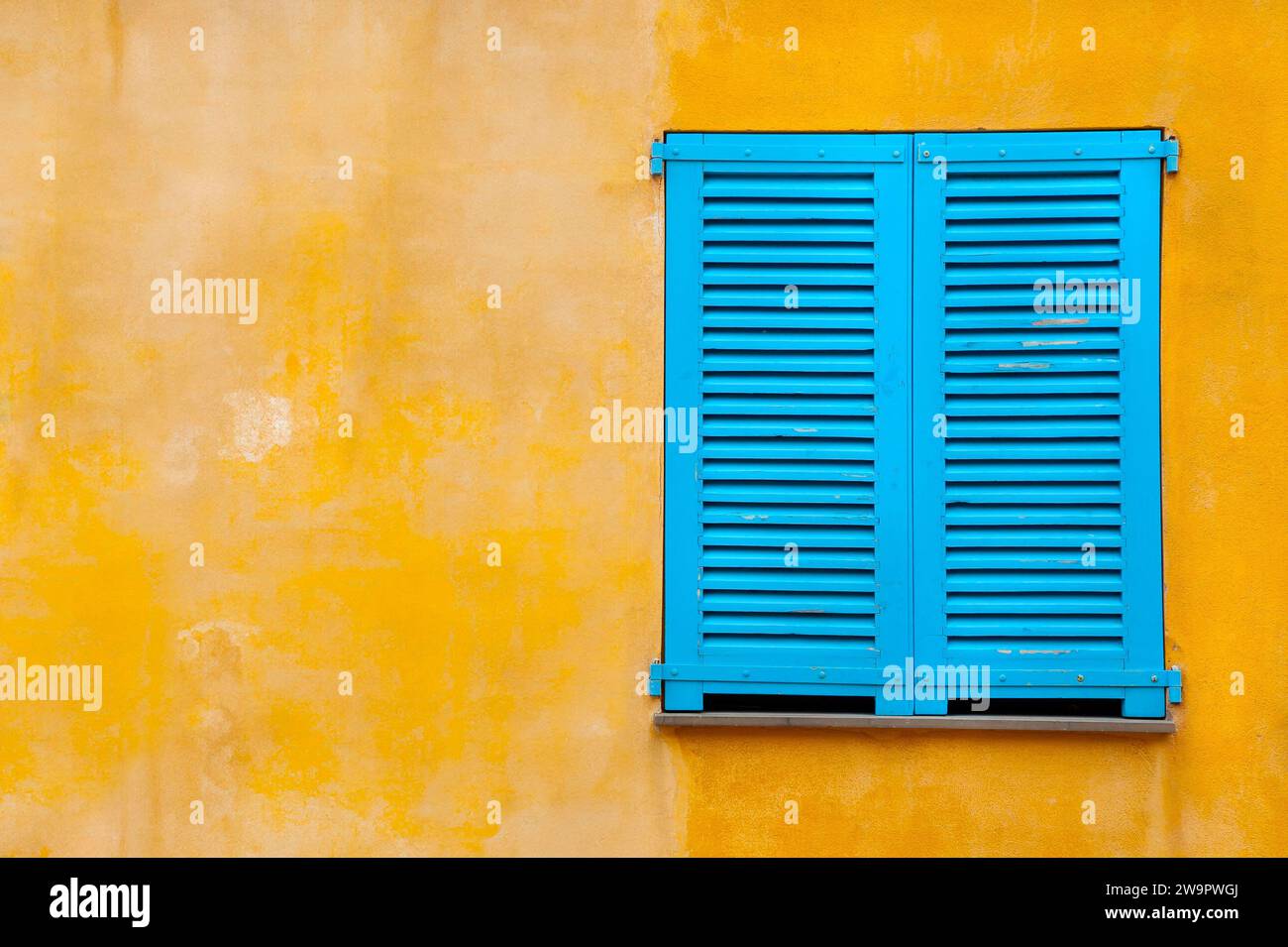 Blue shutter on yellow plaster wall, window, wall, background, texture ...