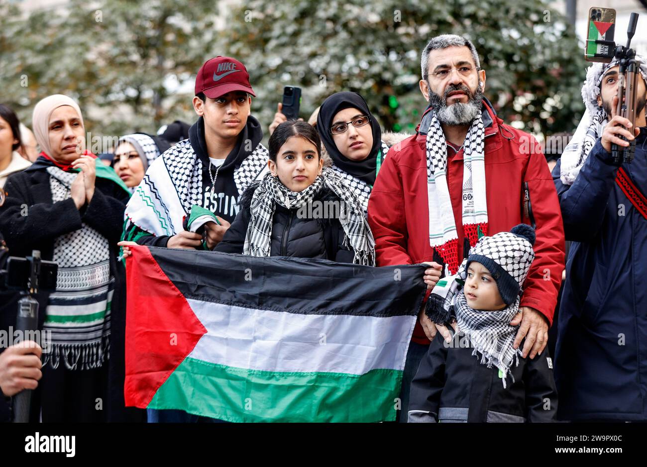 A family shows a Palestinian flag during the demonstration Freedom for ...