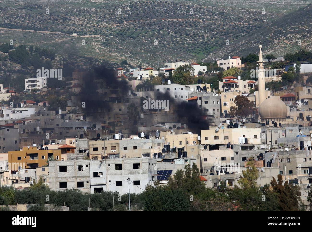 Tubas. 29th Dec, 2023. Smoke rises during clashes in a refugee camp ...