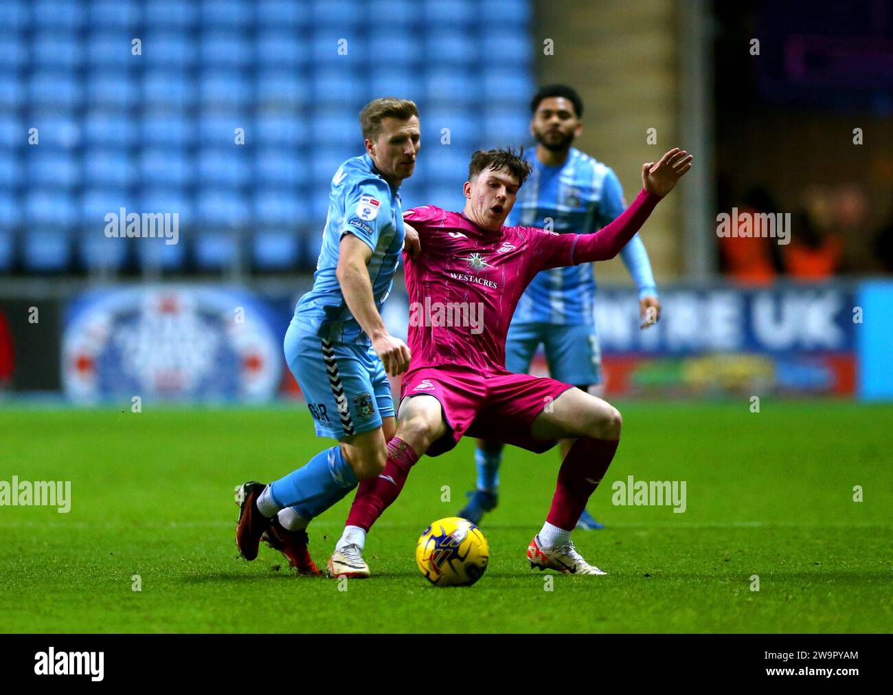 Coventry City's Jamie Allen (left) and Swansea City's Sam Parker battle ...