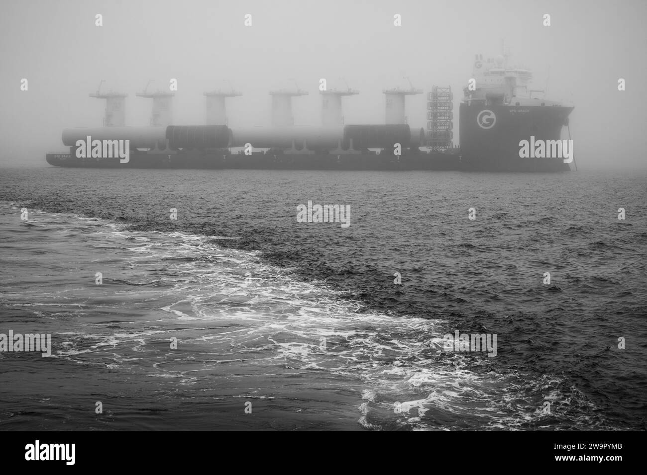 Heavy lift vessel GPO Grace at anchor in the fog with a load of ...