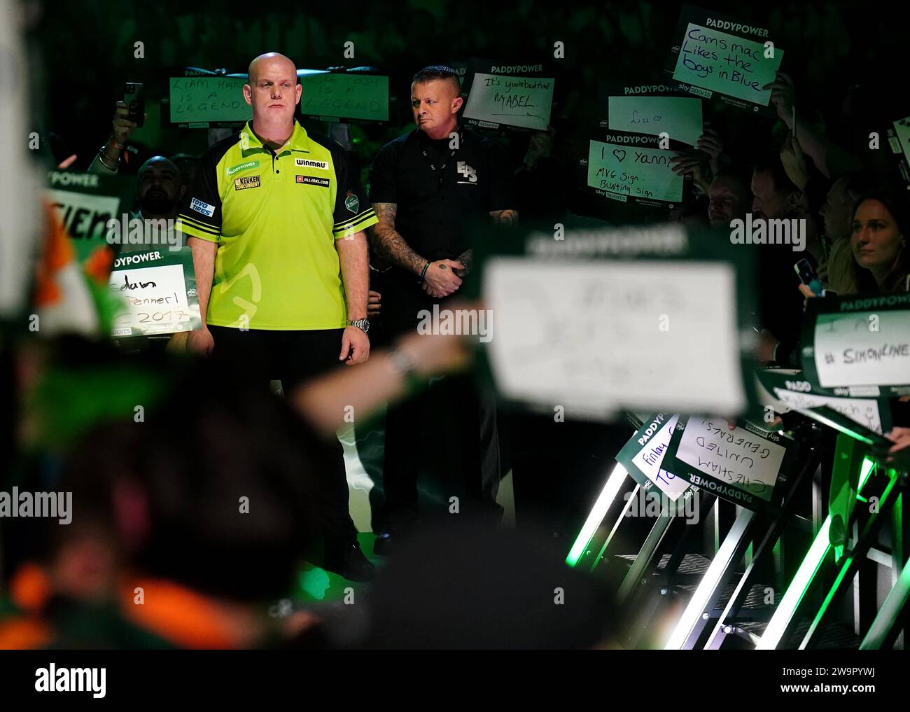 Michael van Gerwen walks out to play Stephen Bunting (not pictured) on ...