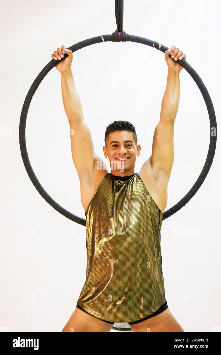 A Mexican man, solo in gymnastics on the aerial ring, creates a dynamic ...