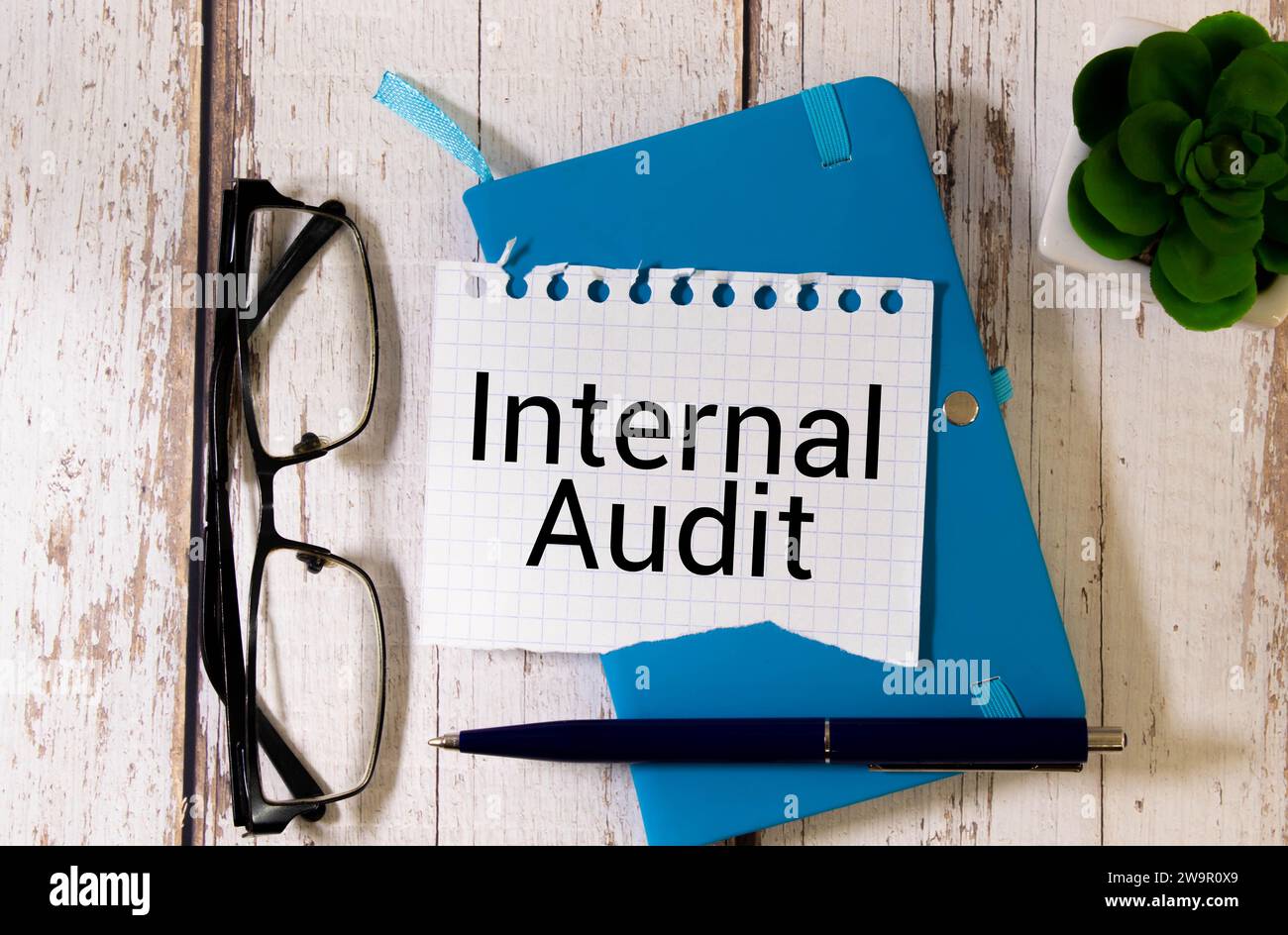 Internal Audit. two cards on a wooden background top view. Place to ...