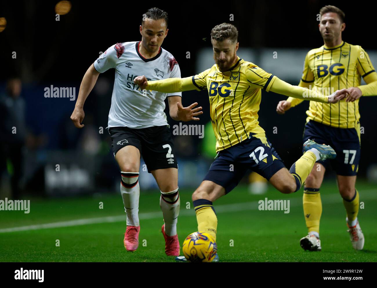 Derby County's Kane Wilson (left) and Oxford United's Joe Bennett ...