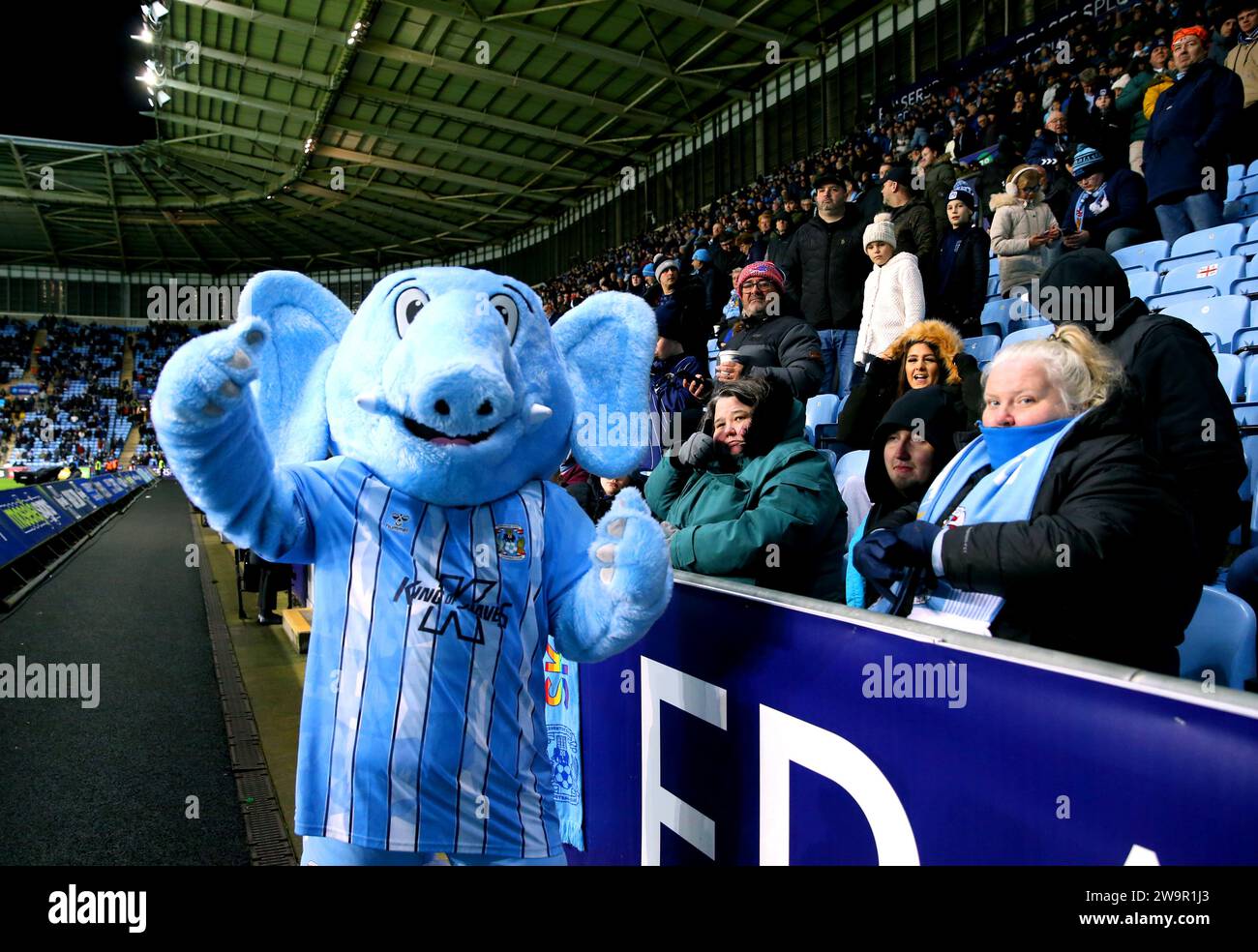 Coventry City mascot Sky Blue Sam interacts with fans in the stands ...