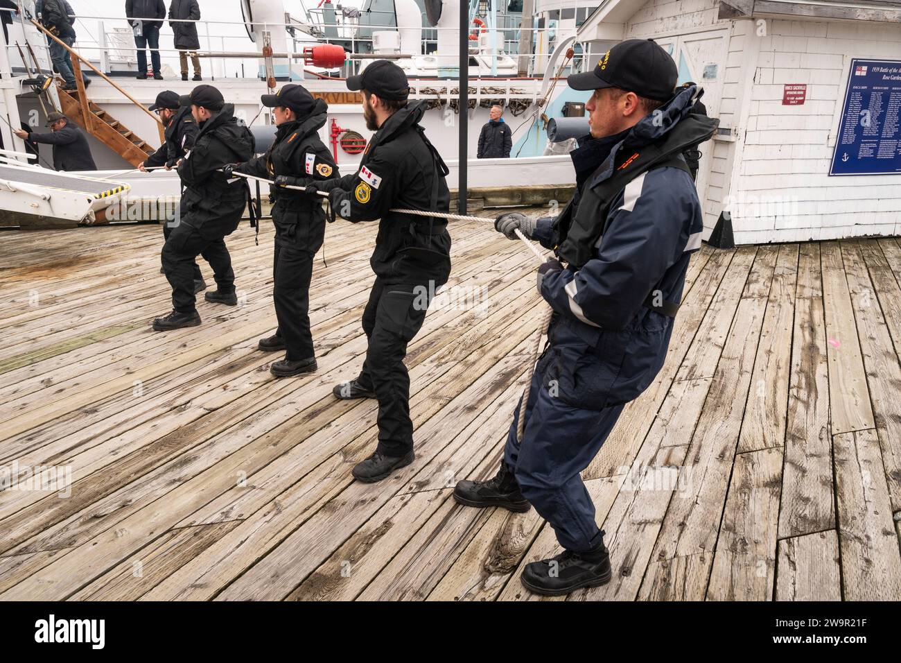 Sailors of the Royal Canadian Navy assist in bringing the preserved ...