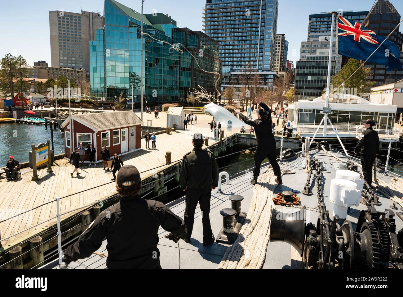Sailors of the Royal Canadian Navy assist in bringing the preserved ...