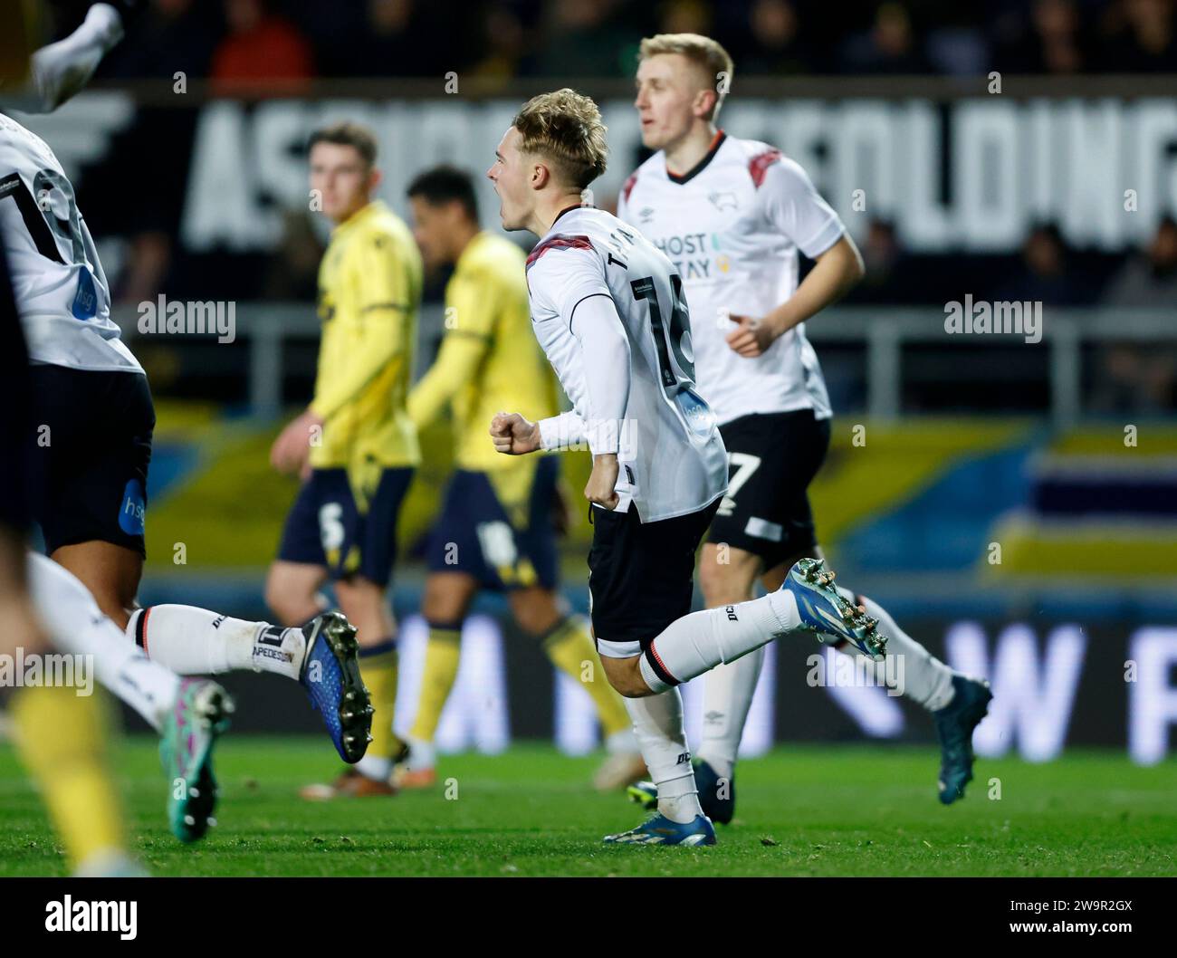 Derby County's Liam Thompson (centre) celebrates scoring his sides ...