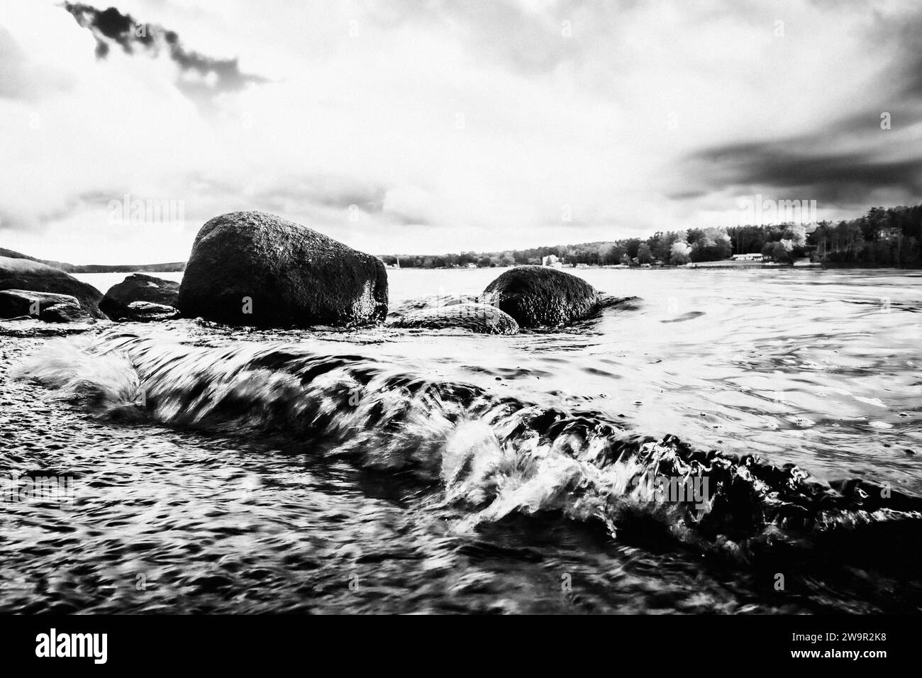 Wave breaking on a beach on the LaHave River in Nova Scotia Stock Photo ...
