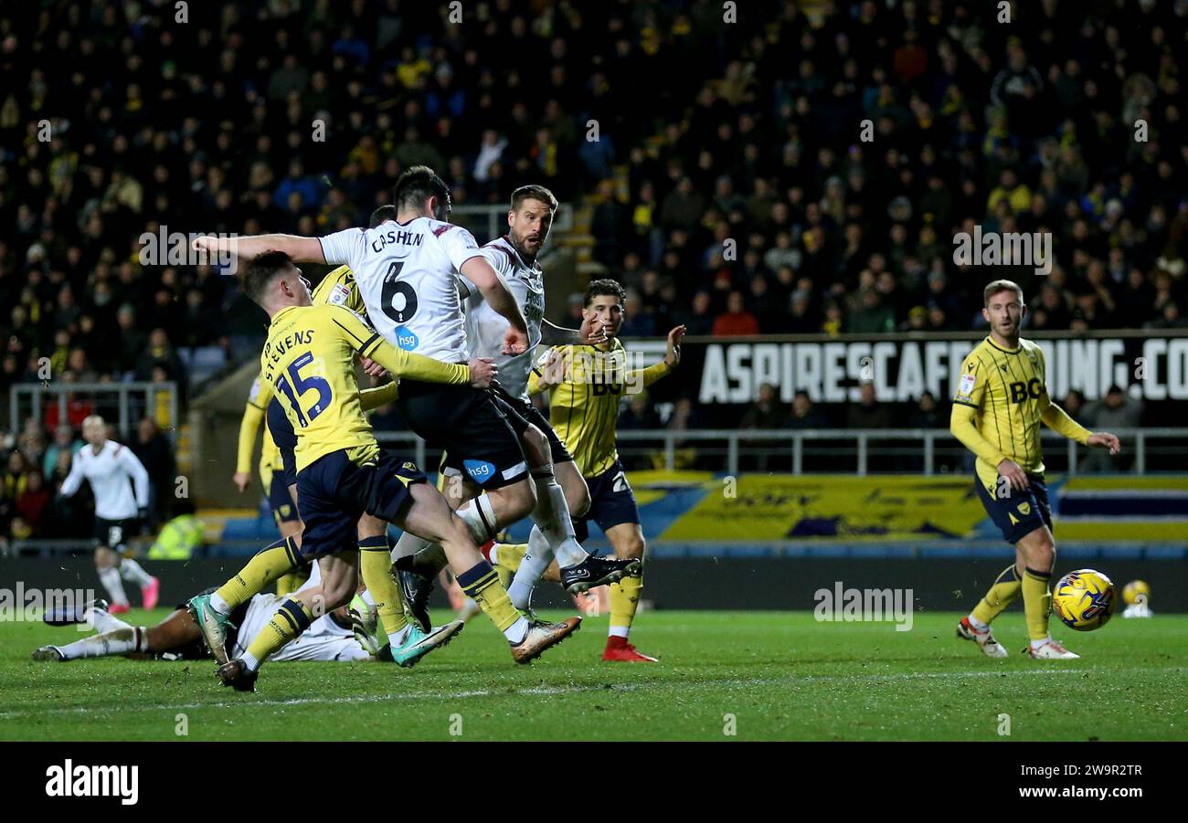 Derby County's Eiran Cashin (second left) scores his sides third goal ...